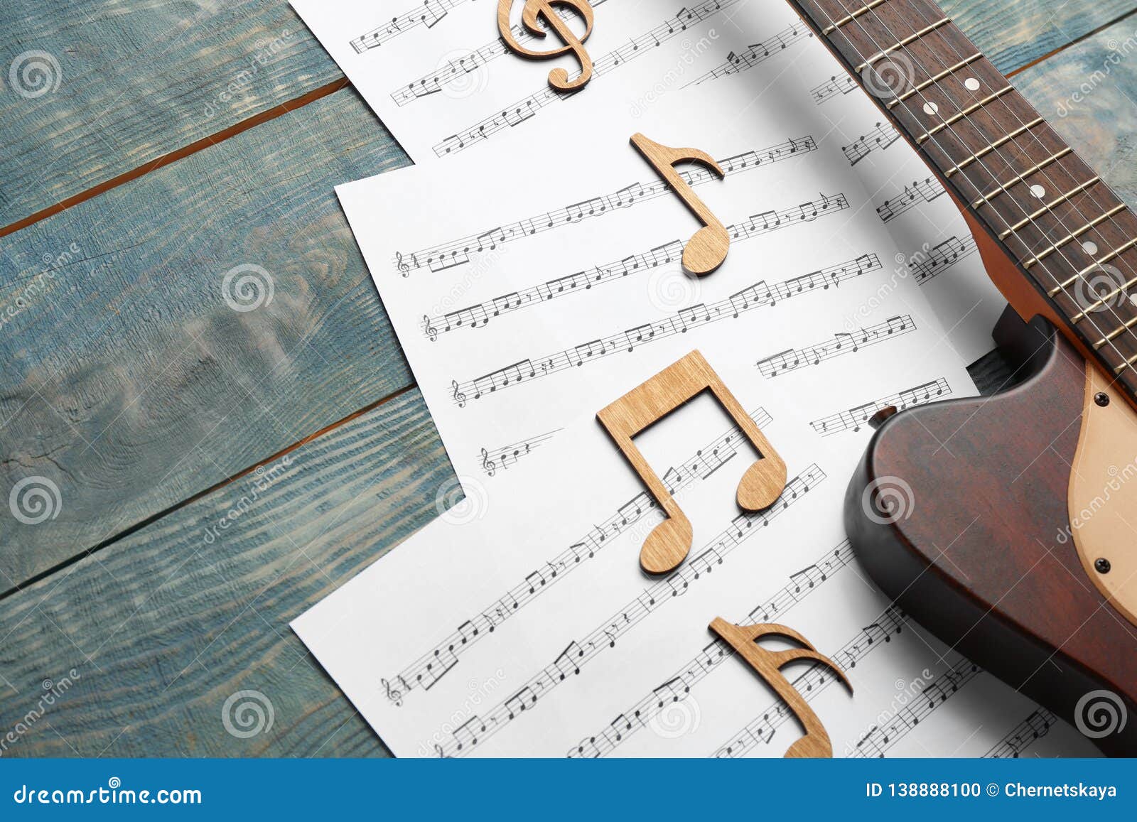 Guitar and Sheets with Music Notes on Table. Space for Text Stock Photo ...