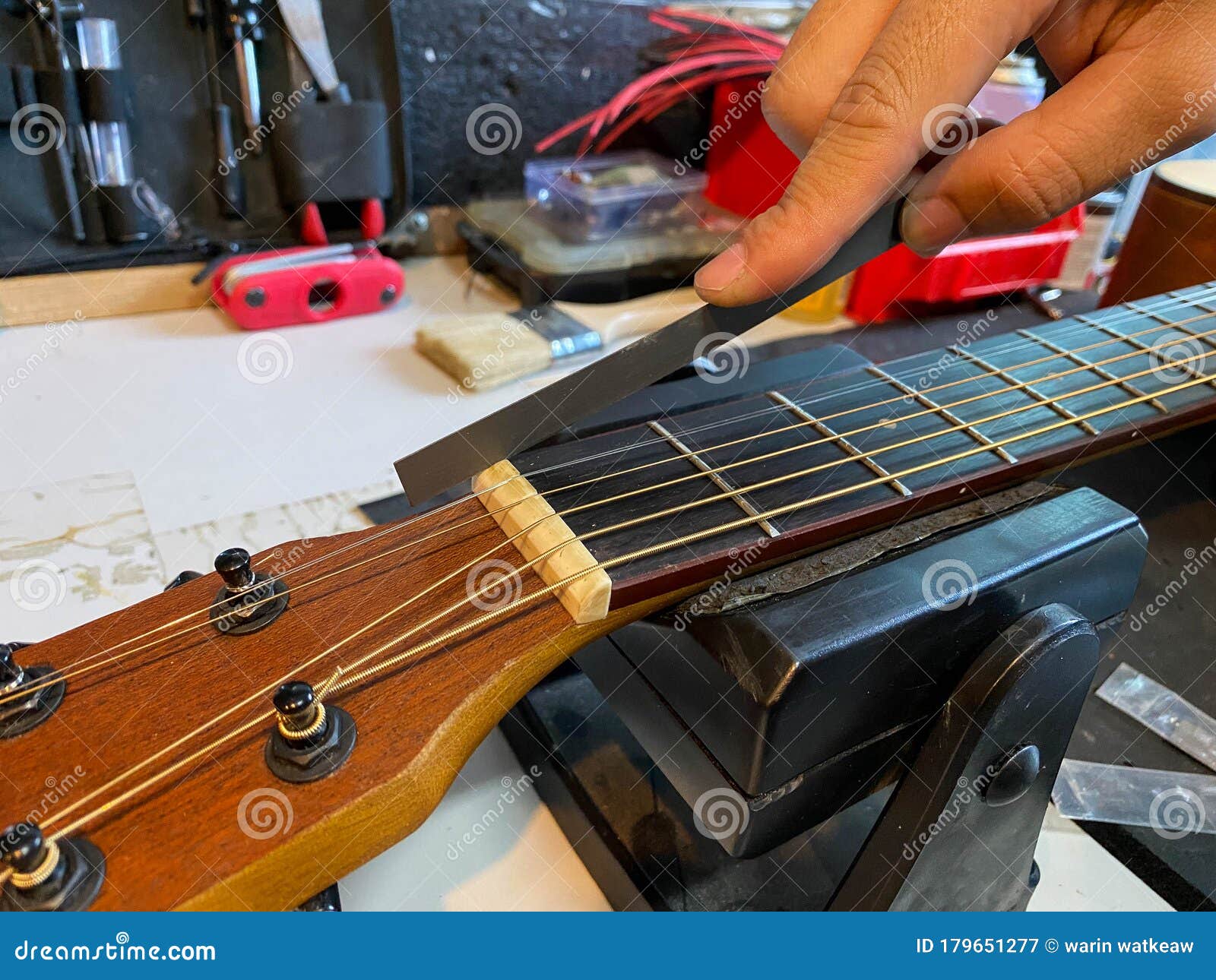 Guitar Technician is Cutting and Shaping String Slots. Stock Image ...