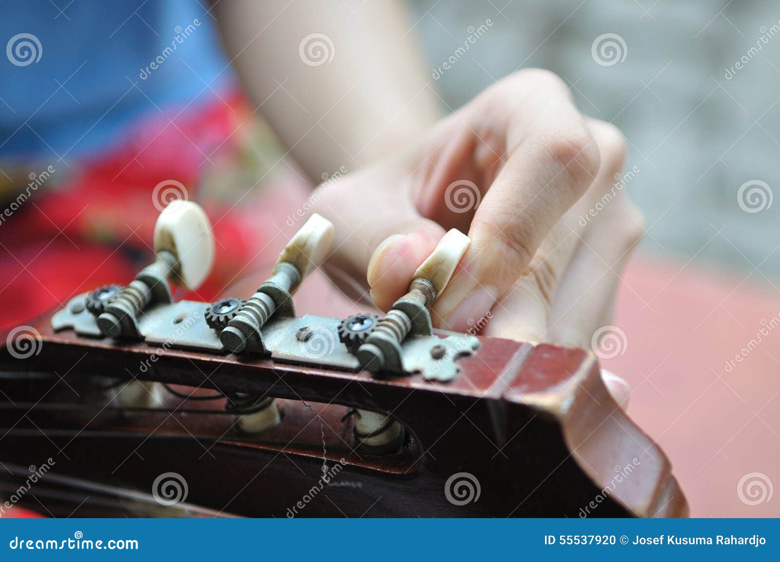 Guitar Tuning stock photo. Image of plucking, outdoors - 55537920