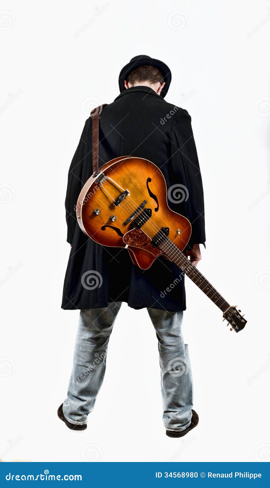 A Guitarist with His Guitar in the Back Stock Photo - Image of musician ...