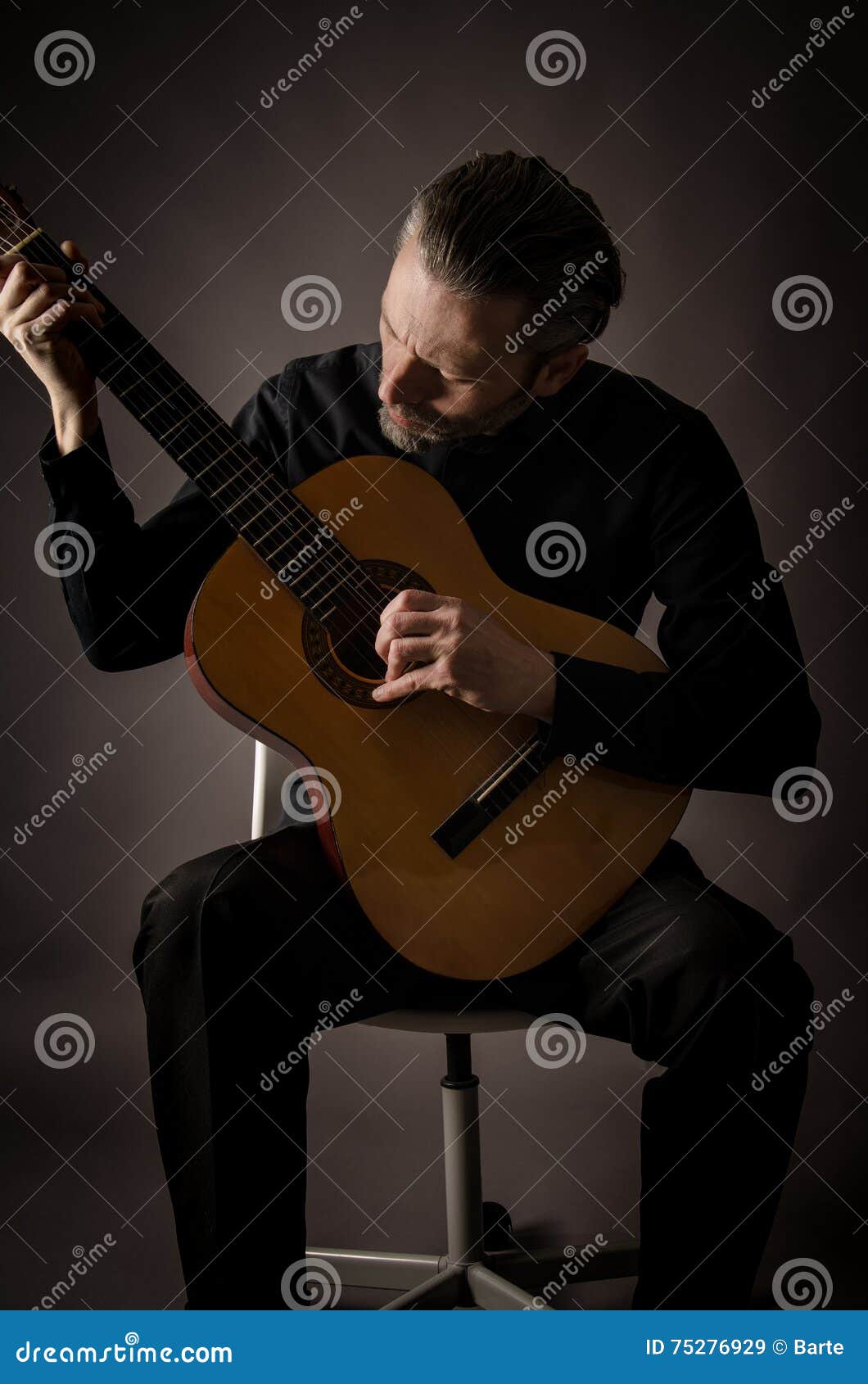 Guitarist in a studio stock image. Image of instrument - 75276929