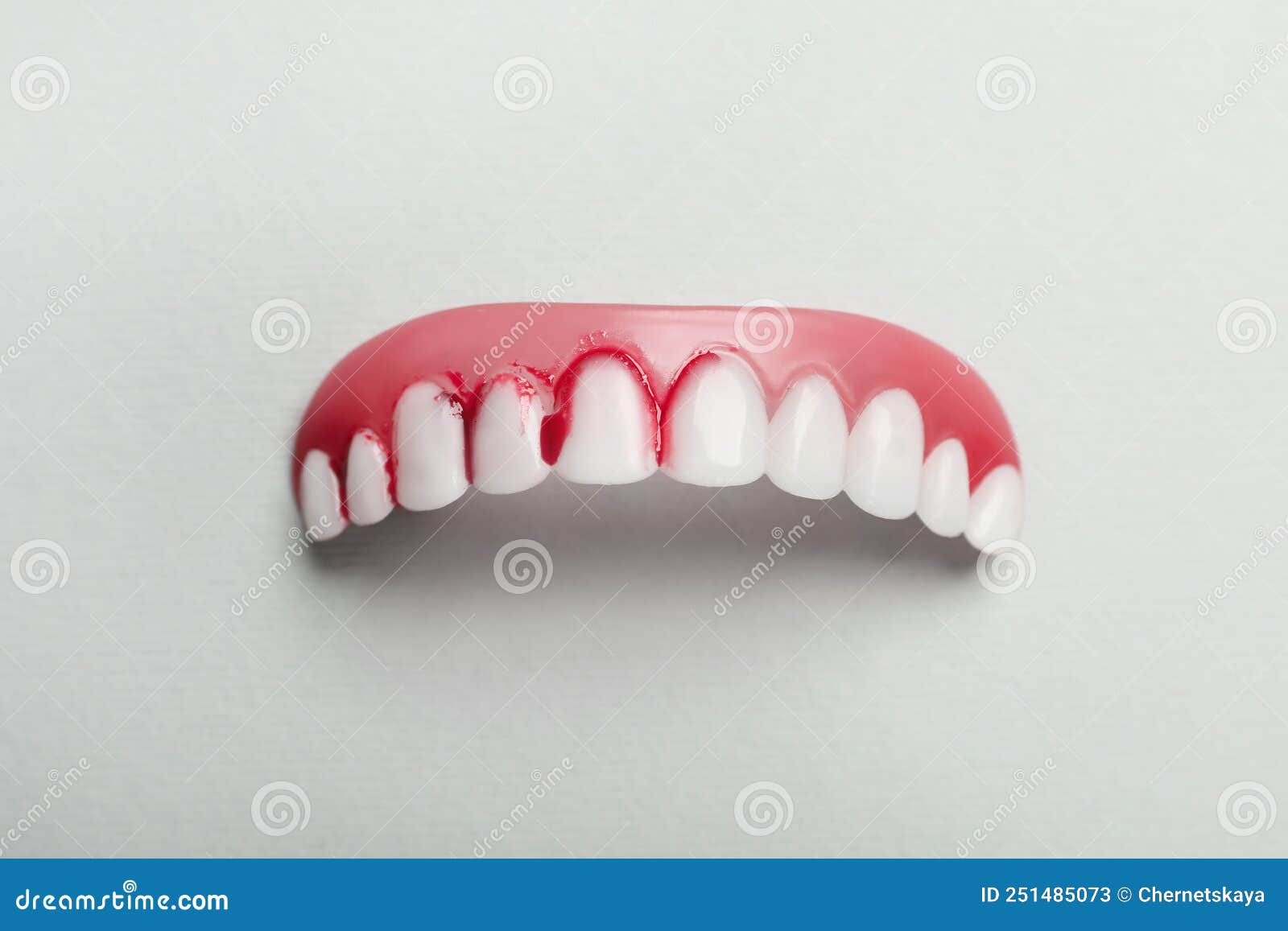 Gum Model with Blood on Teeth Against White Background, Top View Stock ...