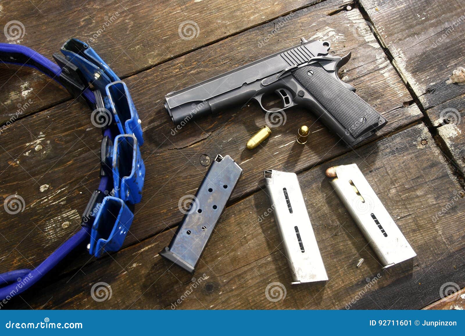 Gun and bullets on a table stock image. Image of bullet - 92711601
