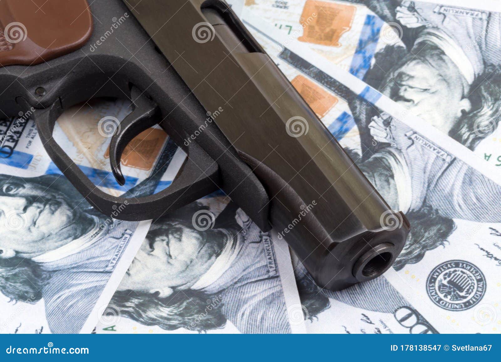 Gun on 100 dollar bills stock image. Image of wealth - 178138547