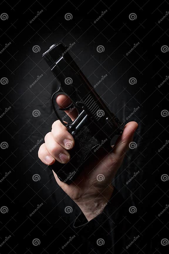 Gun in the hand of man stock photo. Image of male, caucasian - 113674370