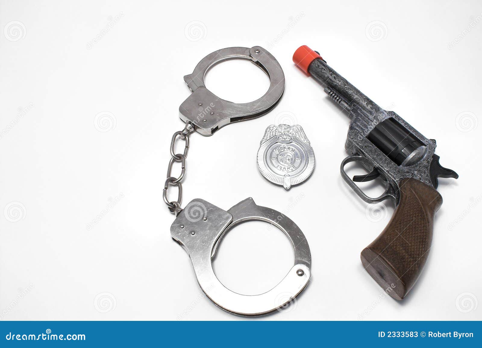 Gun, Handcuffs and Badge stock image. Image of robbers - 2333583
