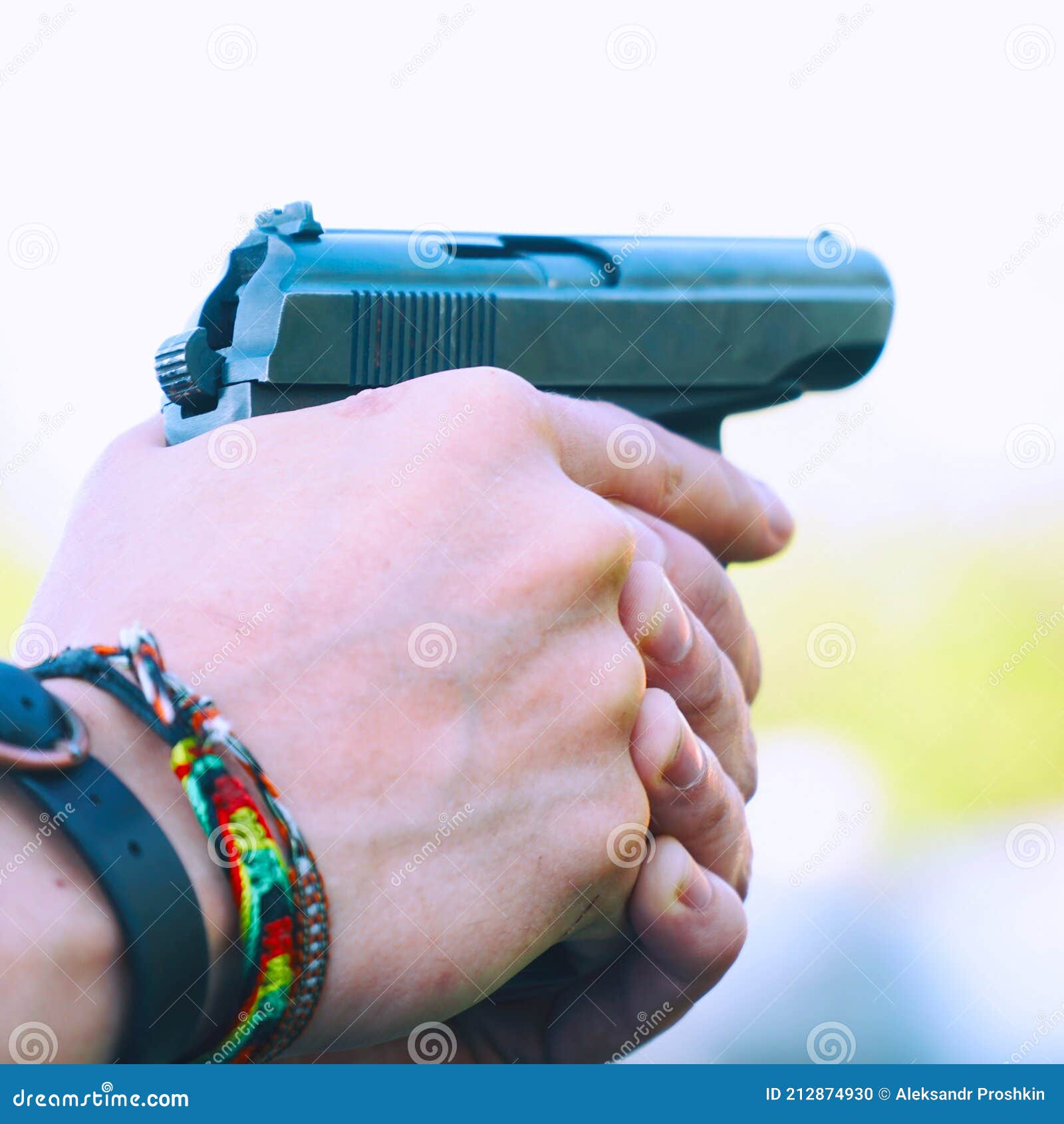 Gun in the hands of man stock photo. Image of fire, handgun - 212874930