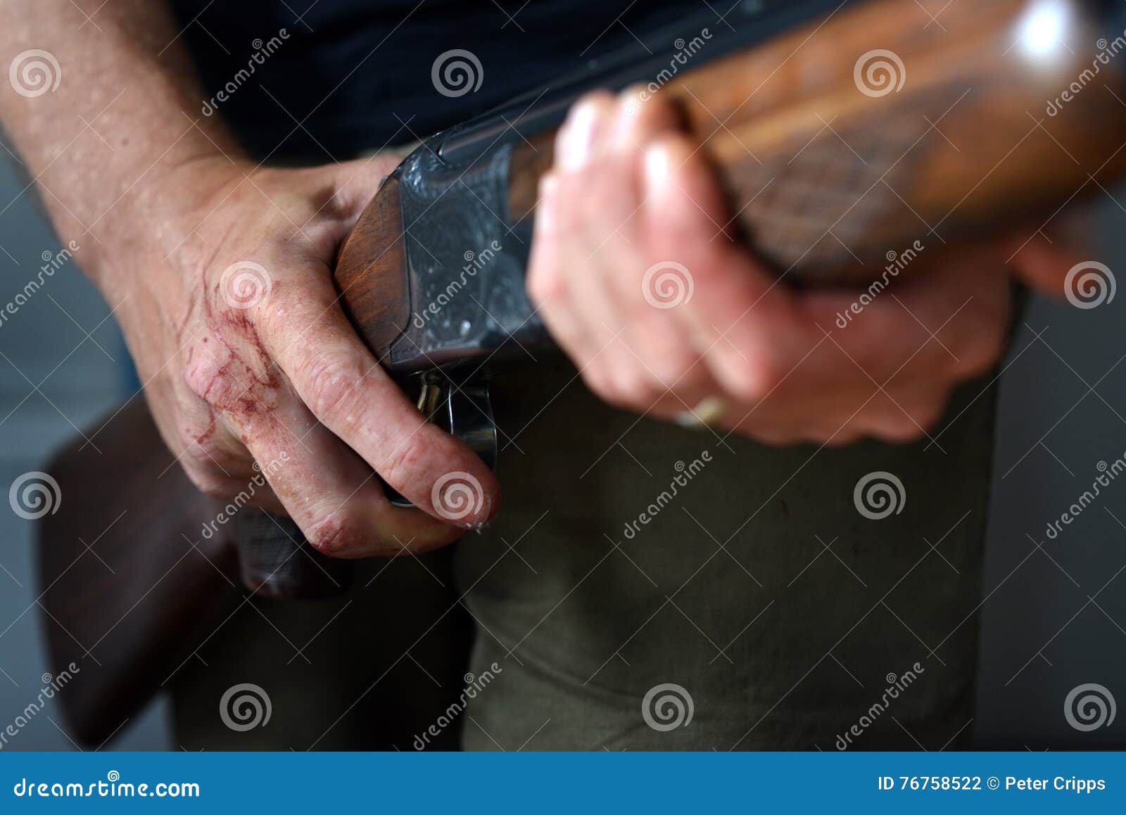 Gun held by bloody hands stock photo. Image of blood - 76758522