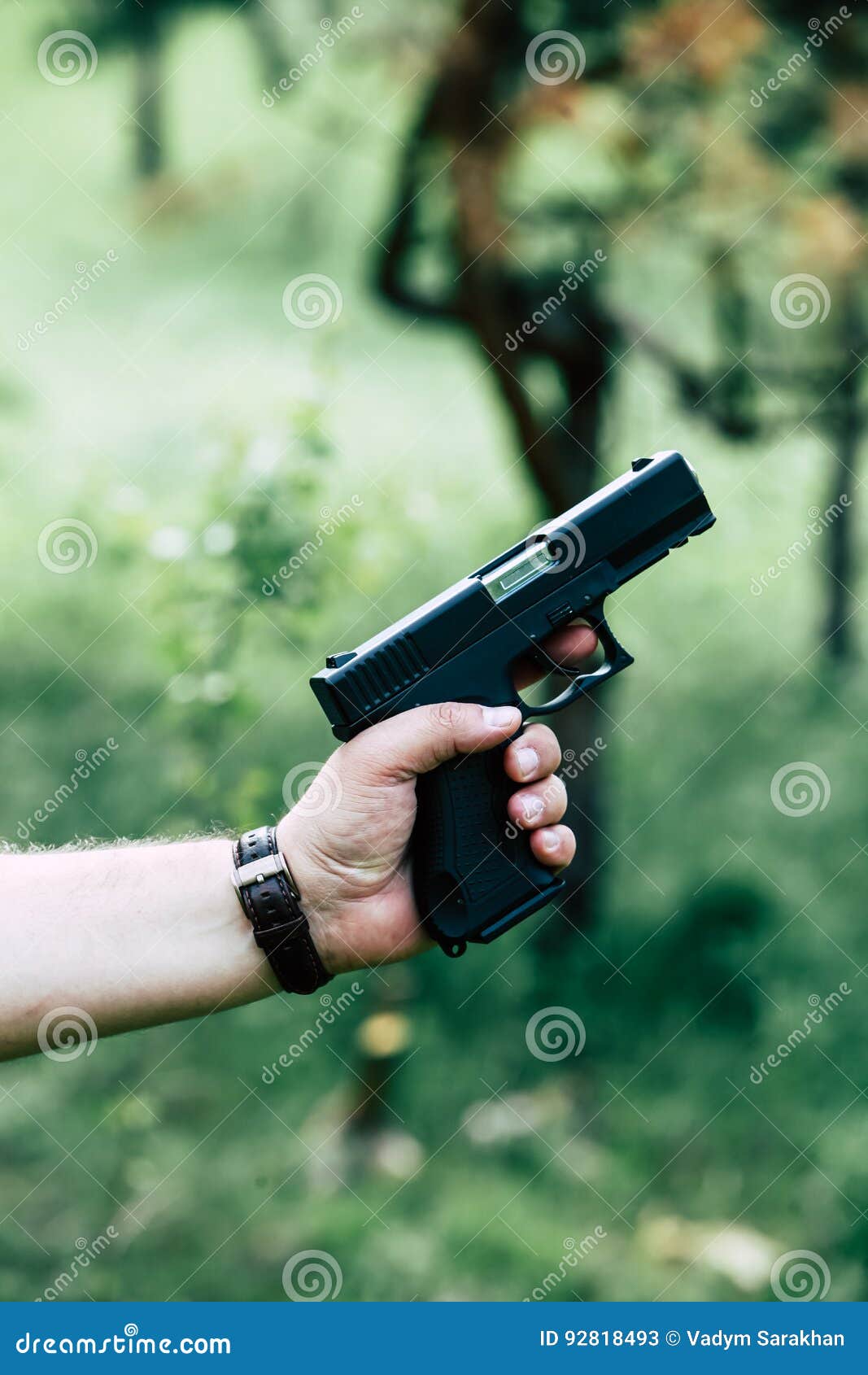 The Gun is in His Hand. the Man is Ready To Shoot at the Target. Stock ...