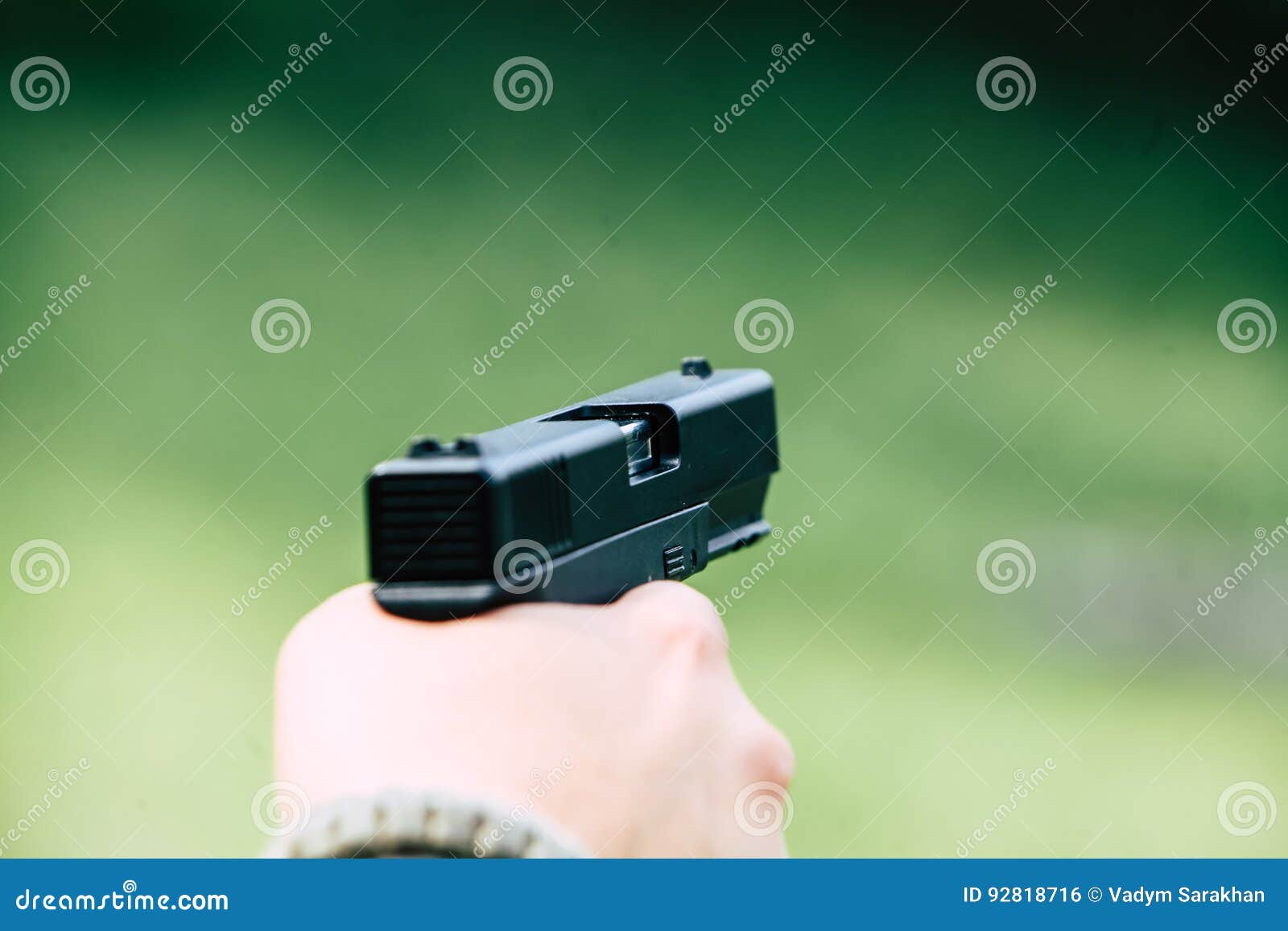 The Gun is in His Hand. the Man is Ready To Shoot at the Target. Stock ...