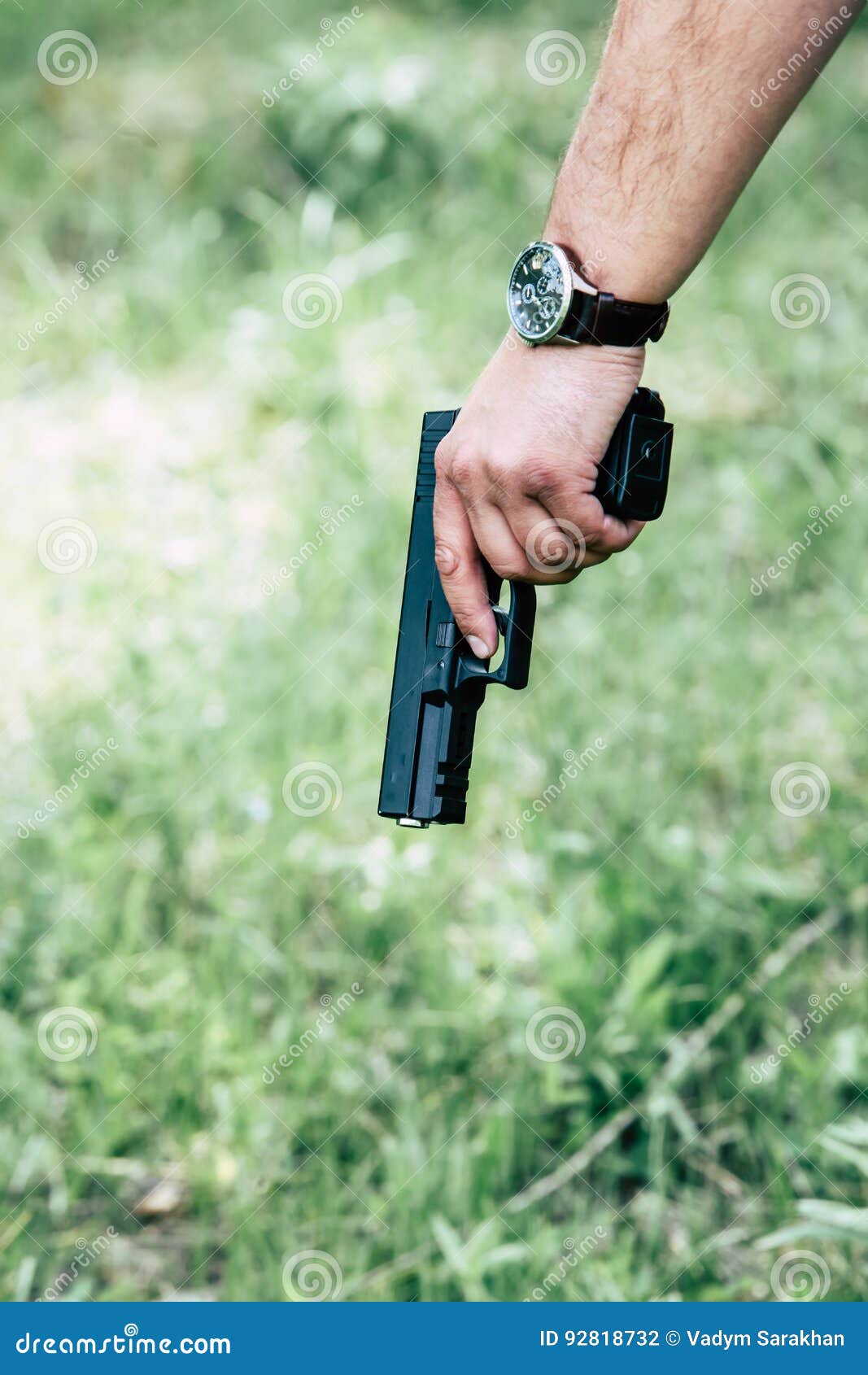 The Gun is in His Hand. the Man is Ready To Shoot at the Target. Stock ...