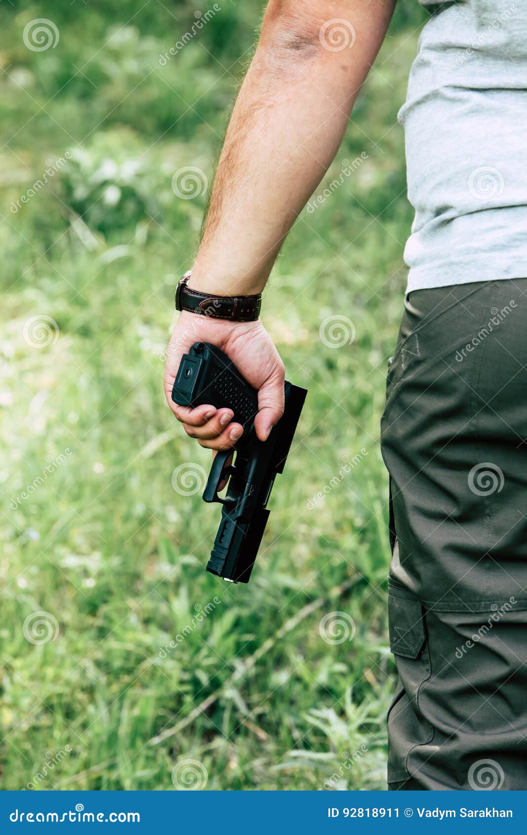 The Gun is in His Hand. the Man is Ready To Shoot at the Target. Stock ...