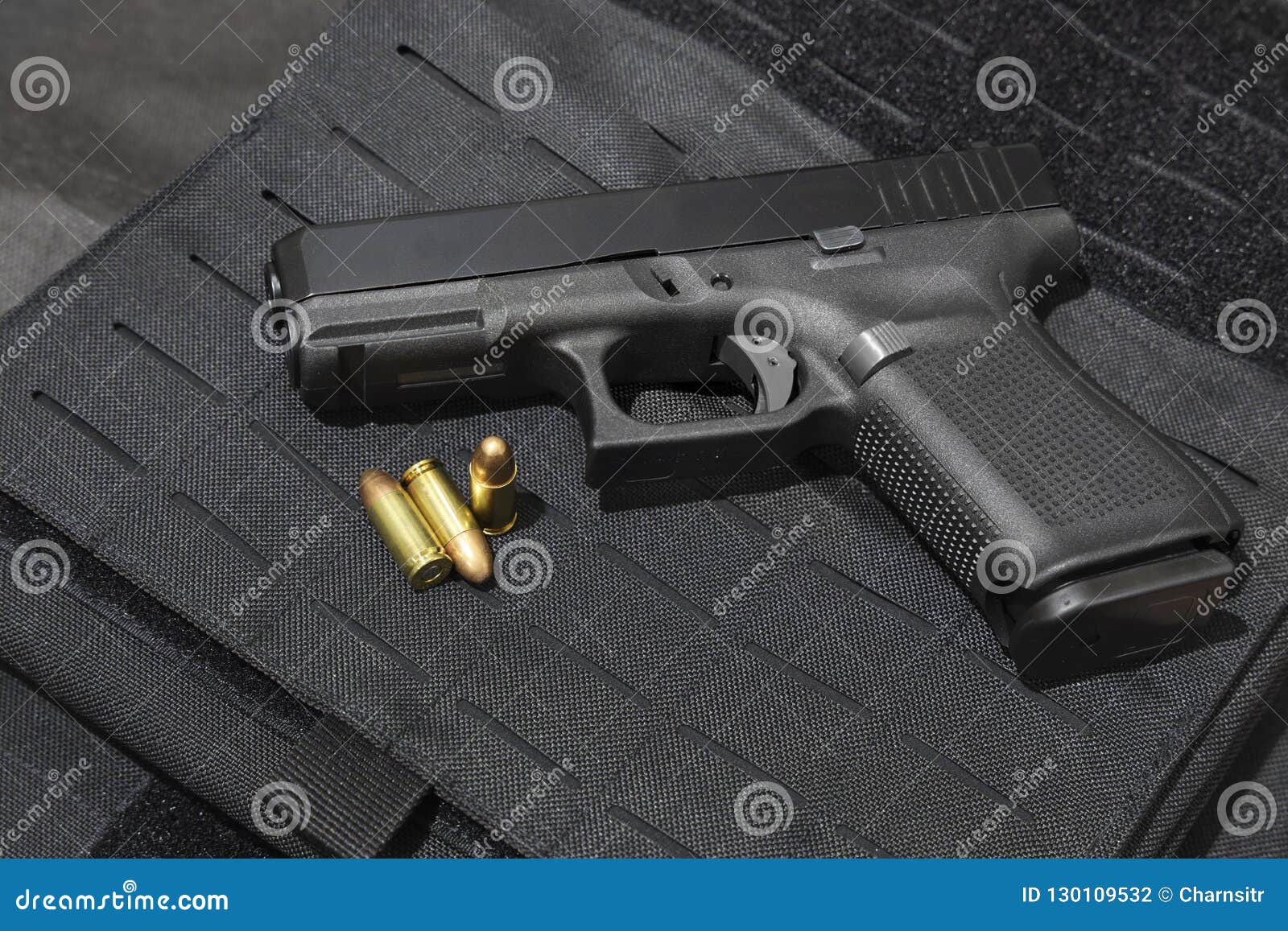Gun and 9mm Bullets on a Bulletproof Jacket Stock Photo - Image of ...