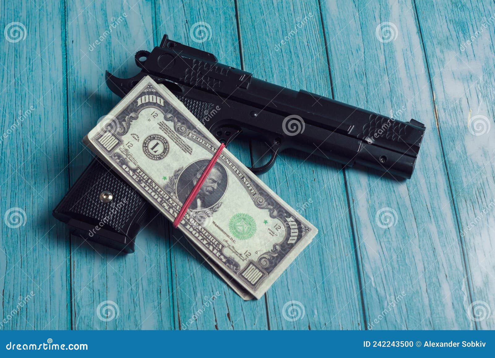 A Gun and a Pack of Dollars Stock Photo - Image of gadget, wing: 242243500
