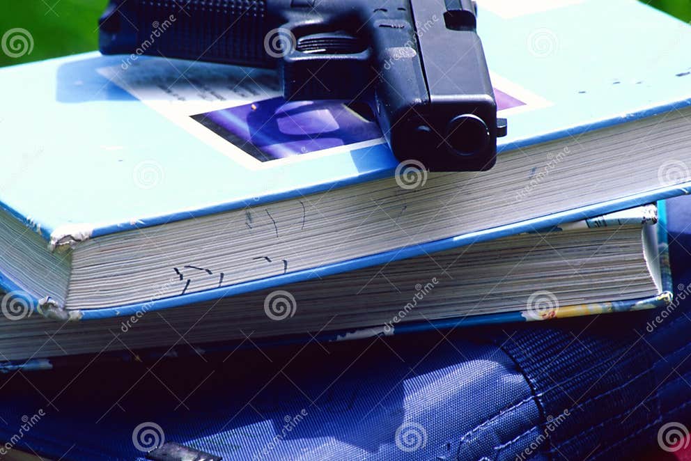 Gun on school books stock photo. Image of fear, danger - 4949710