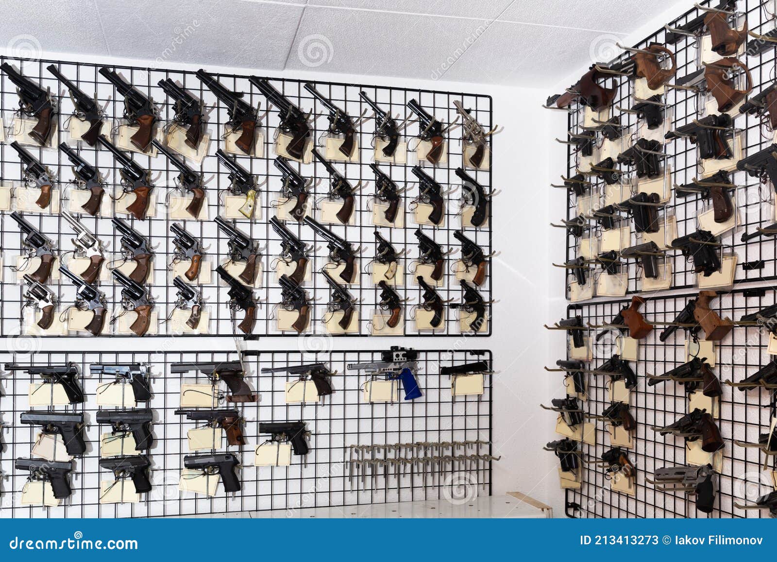 Gun Shop Interior with Handguns Displayed on Rack Stock Image - Image ...