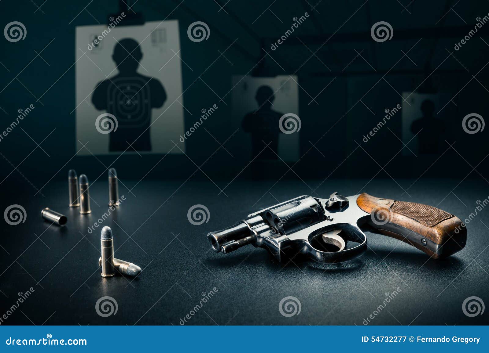 Gun Sitting on a Table at a Shooting Range / Dramatic Lighting Stock ...