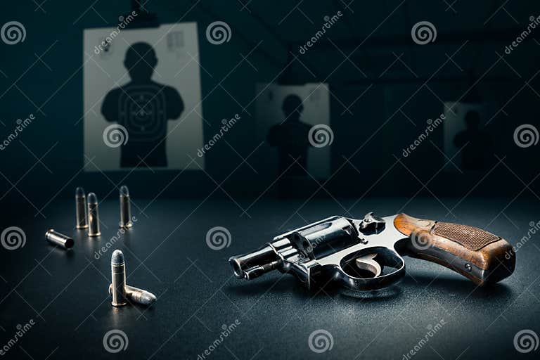 Gun Sitting on a Table at a Shooting Range / Dramatic Lighting Stock ...