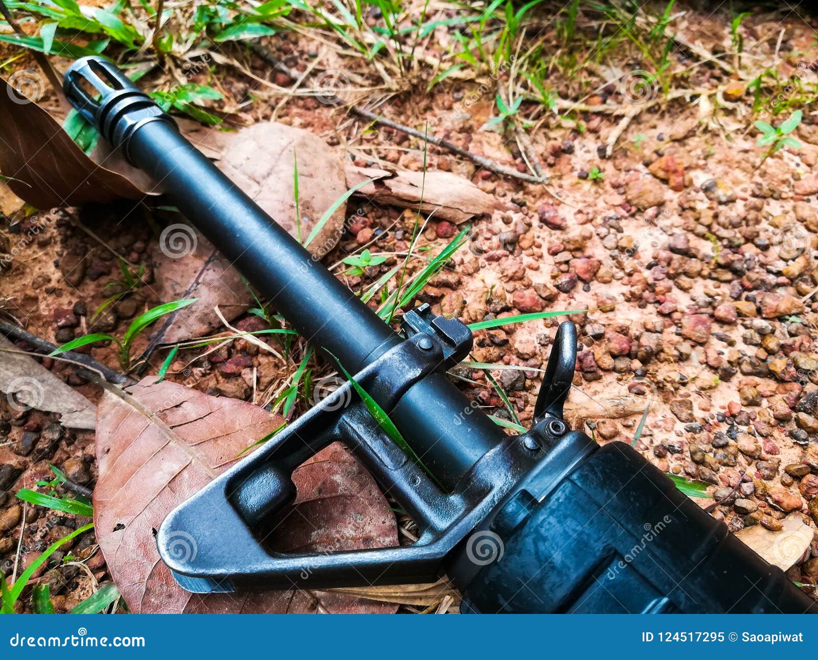 Gun of soldier on ground. stock image. Image of black - 124517295
