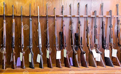 Gun Store Interior with Rifles on Showcase Stock Photo - Image of ...