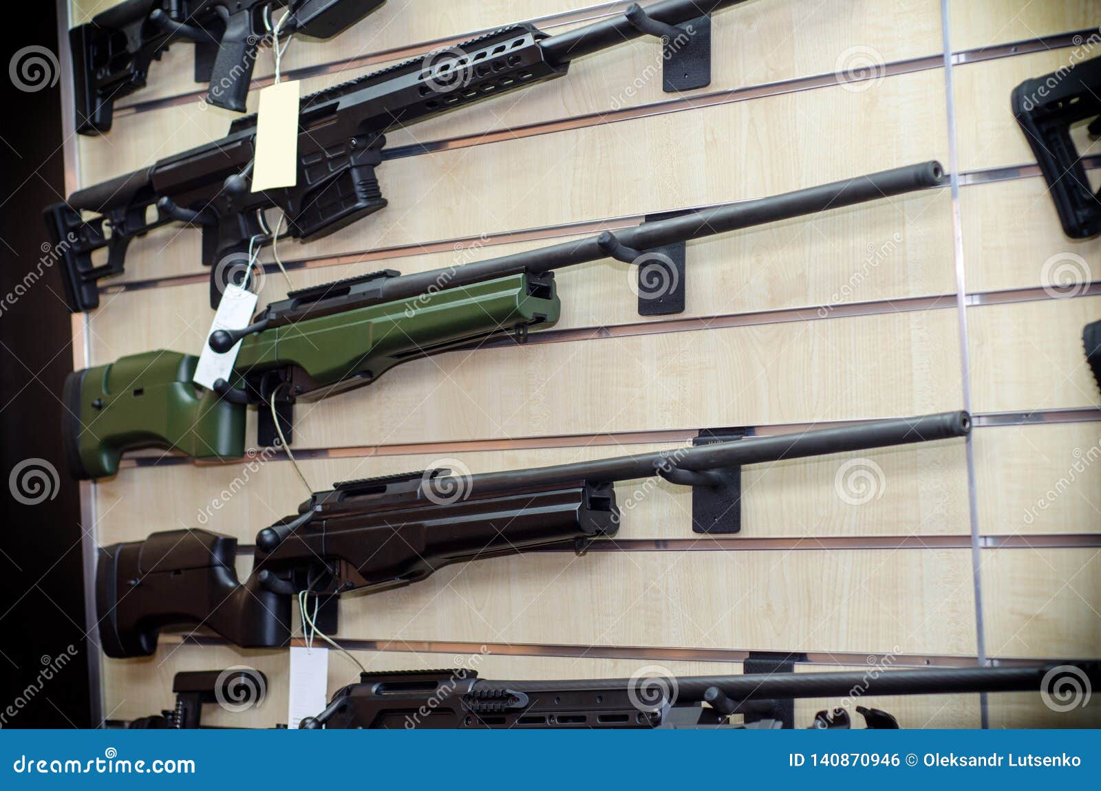 Gun wall rack with rifles stock photo. Image of action - 140870946