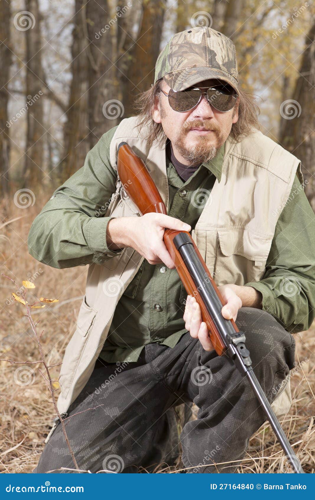 Gunman in the forest stock photo. Image of hunter, adult - 27164840