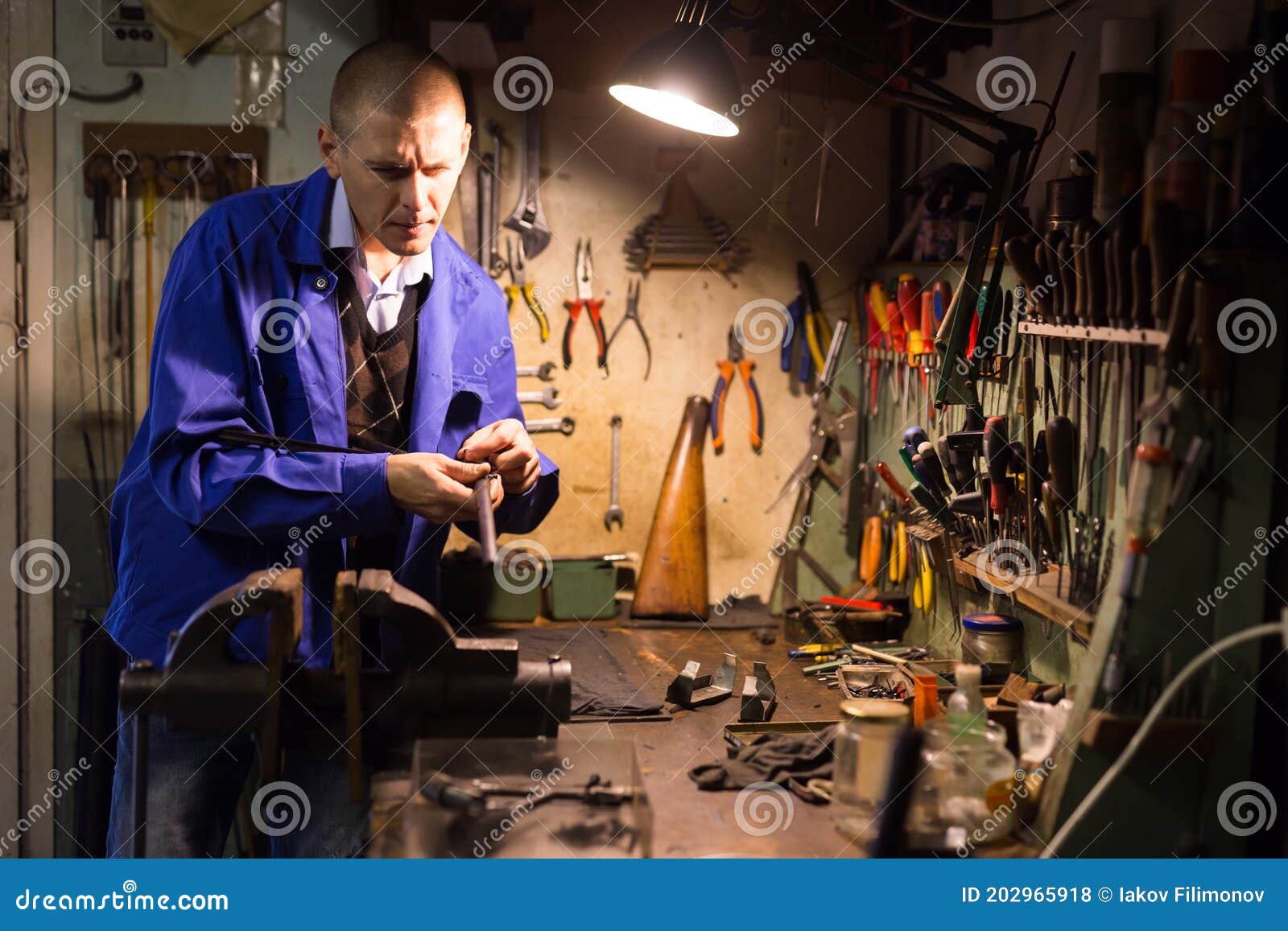 Gunsmith Assembling Shotgun after Diagnostics and Repair in Weapons ...