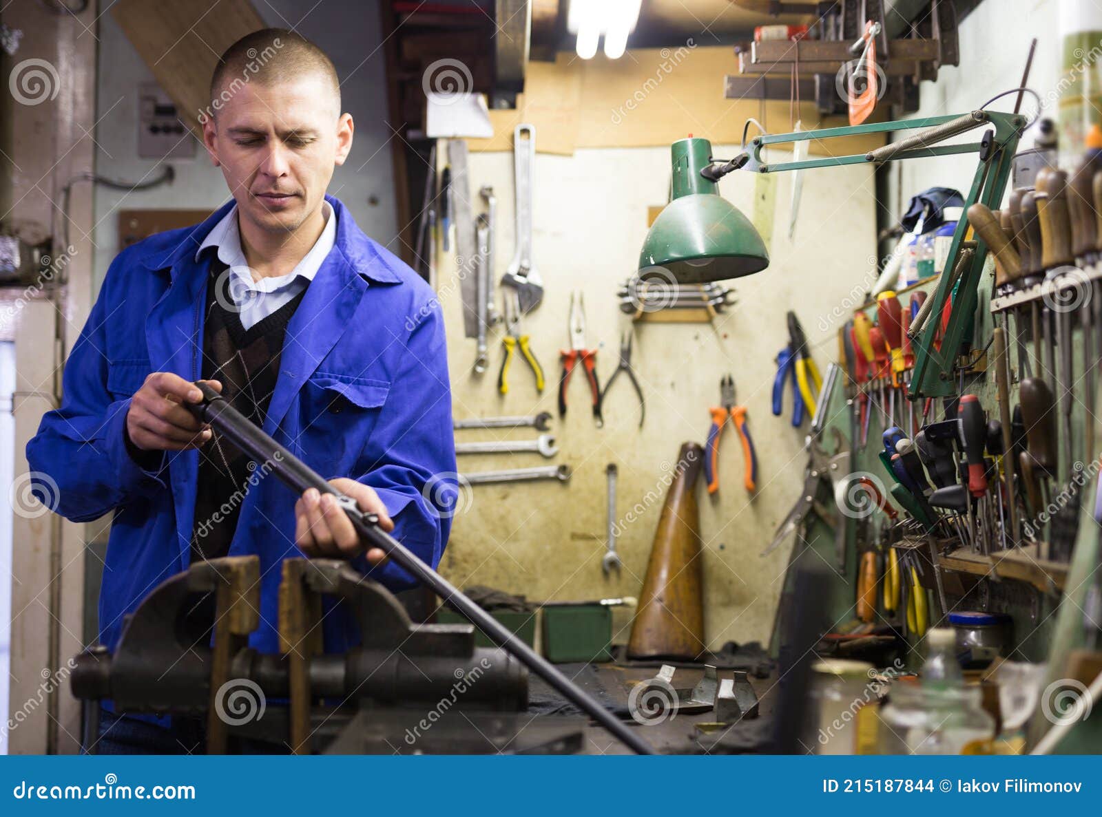 Gunsmith Assembling Shotgun after Diagnostics and Repair in Weapons ...