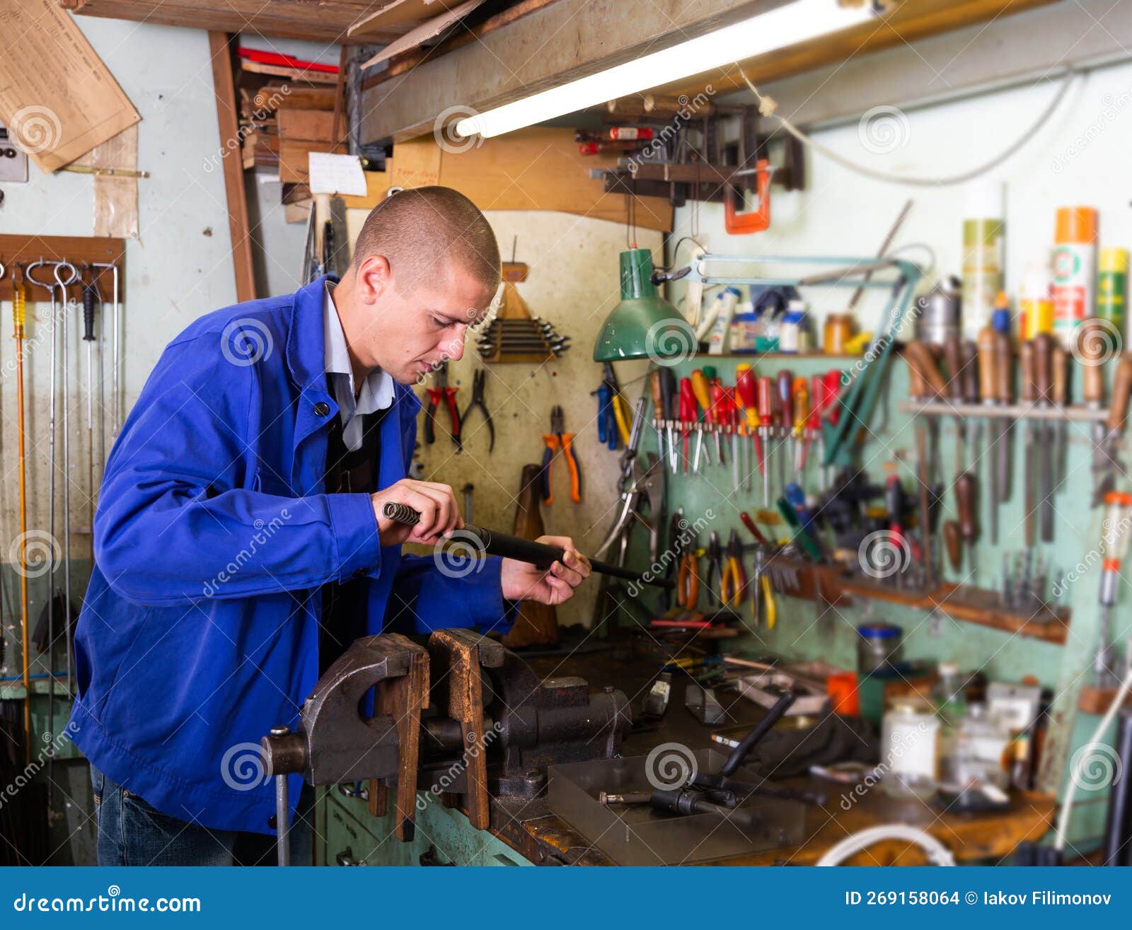 Gunsmith Assembling Shotgun after Diagnostics and Repair in Weapons ...