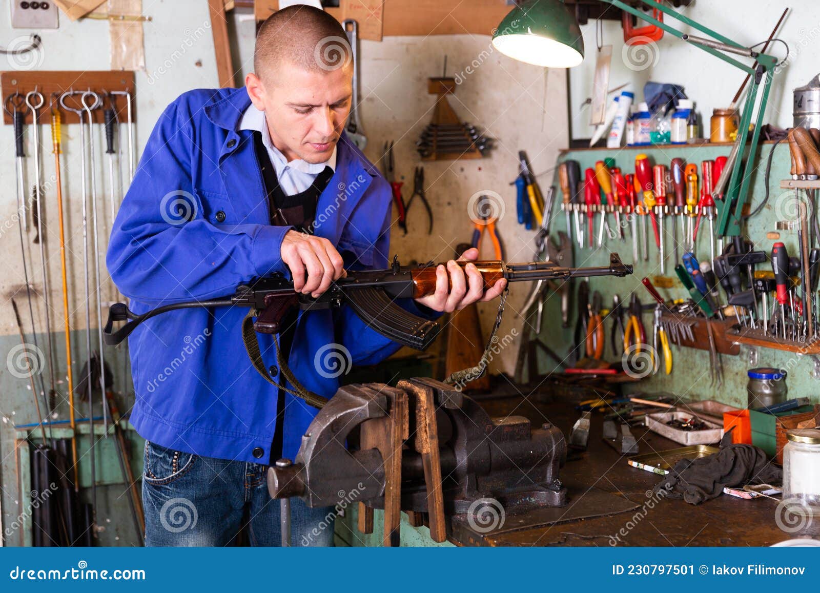 Gunsmith Checks Kalashnikov Assault Rifle in Weapons Workshop Stock ...
