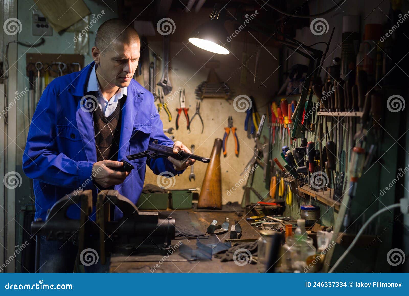Gunsmith Disassembles and Repairs Pistol in Weapons Workshop Stock ...