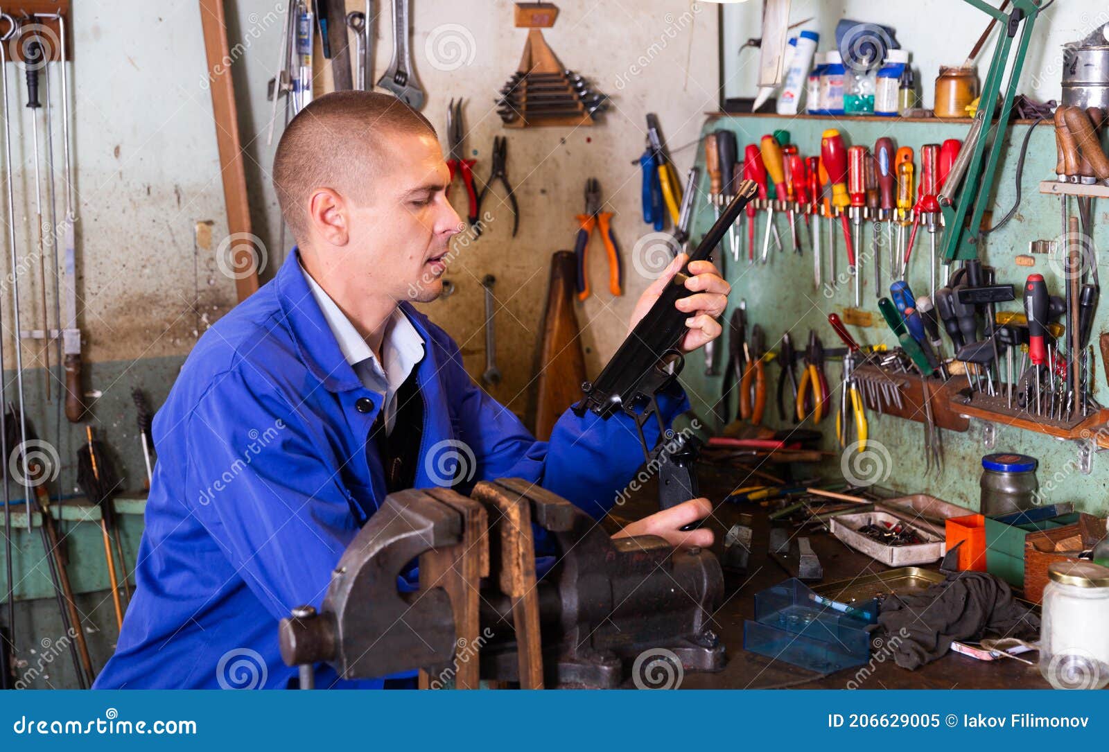 Gunsmith Disassembles and Repairs Pistol in Weapons Workshop Stock ...