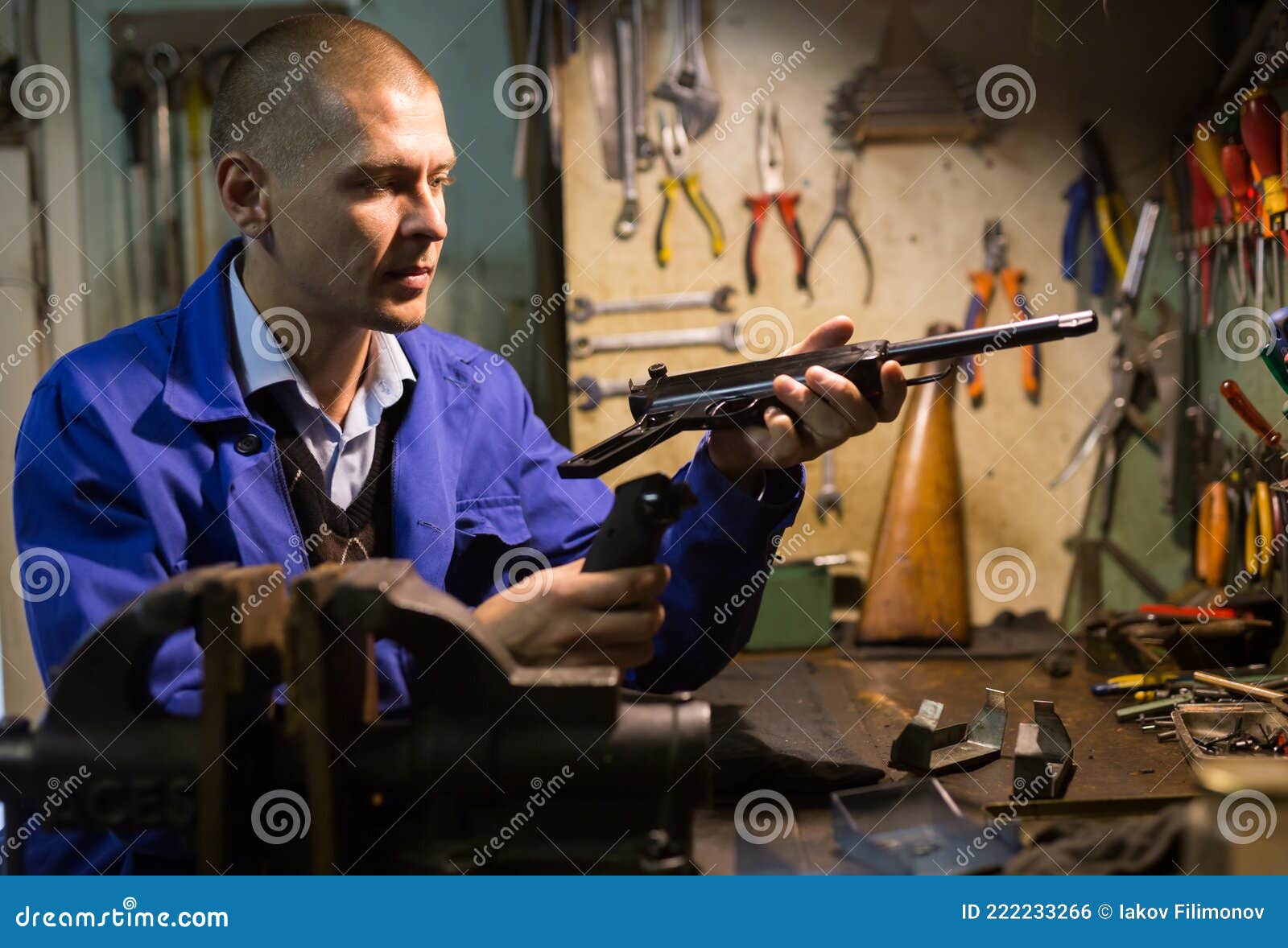 Gunsmith Disassembles and Repairs Pistol in Weapons Workshop Stock ...