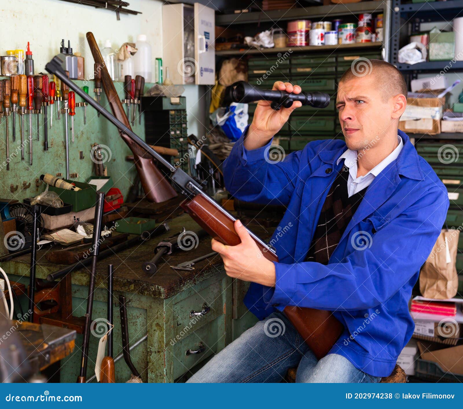 Gunsmith Installing Optical Sight on Rifle in Weapons Workshop Stock ...