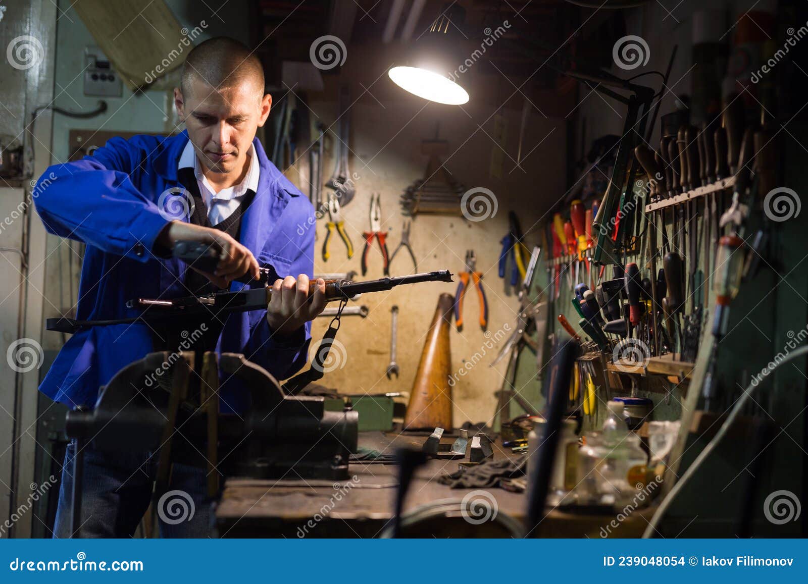 Gunsmith with Kalashnikov Assault Rifle in Weapons Workshop Stock Photo ...