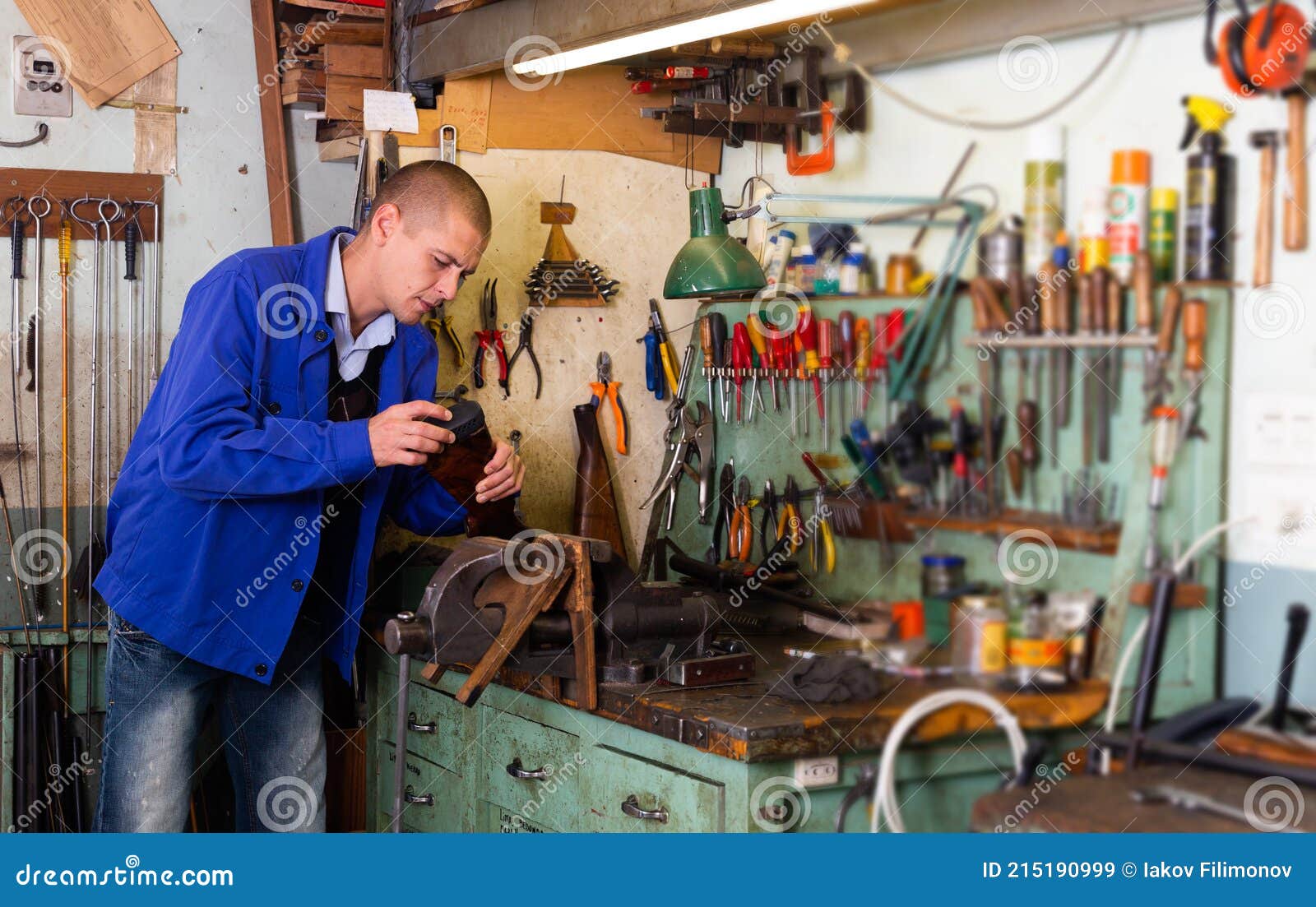 Gunsmith Repairs of a Shotgun in Weapons Workshop Stock Image - Image ...