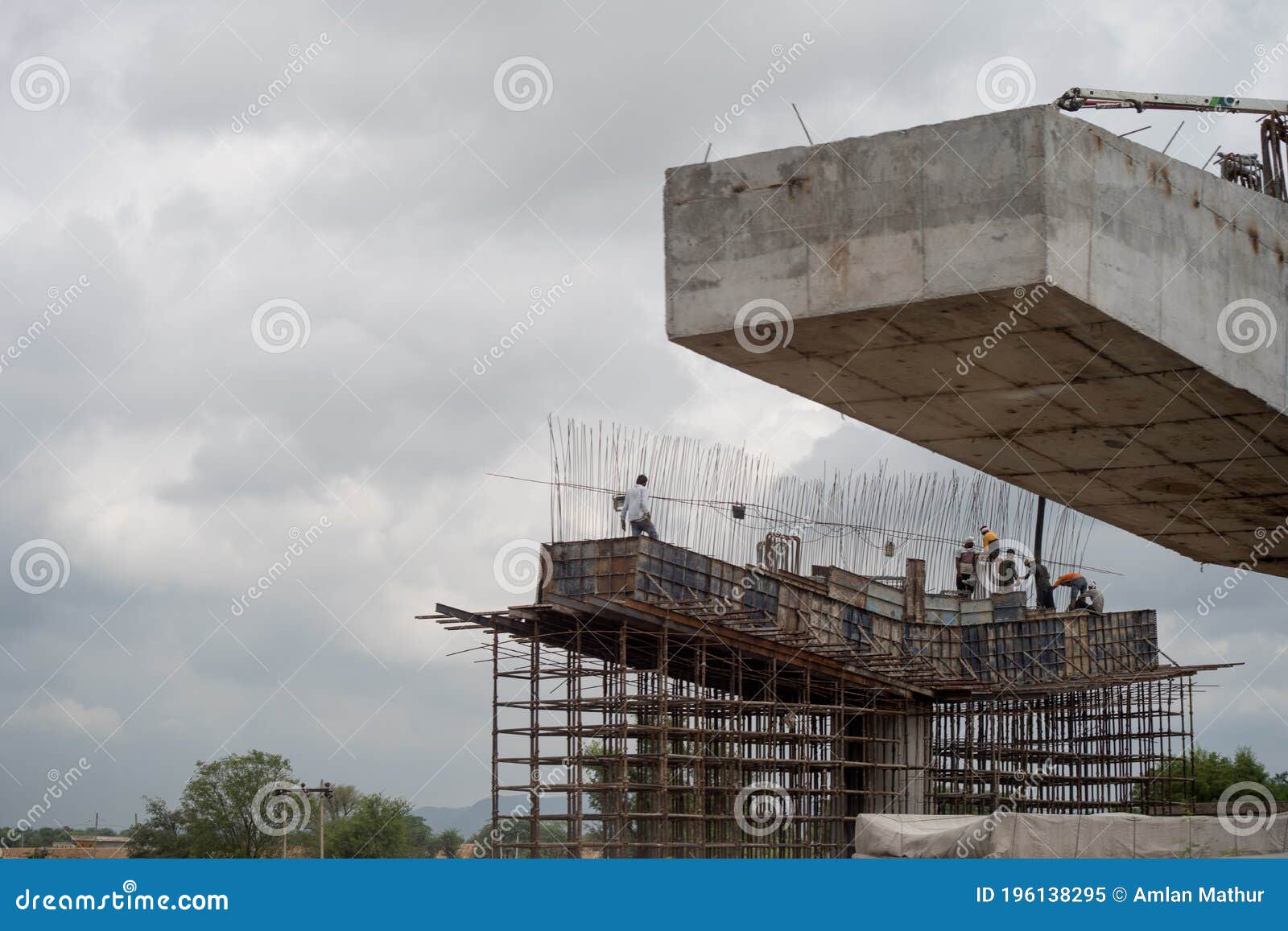 Labor and Workers Standing on a Support for a Bridge Under Construction ...