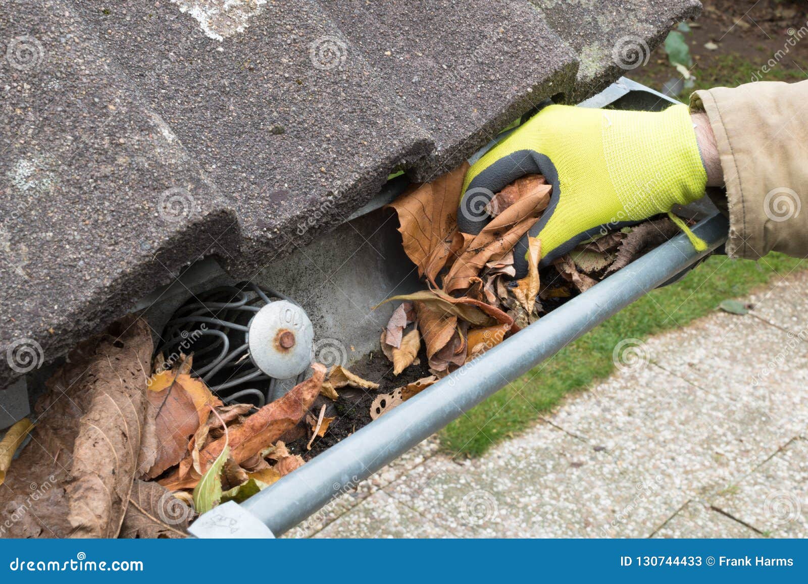 Man is cleaning the gutter stock image. Image of repair - 130744433