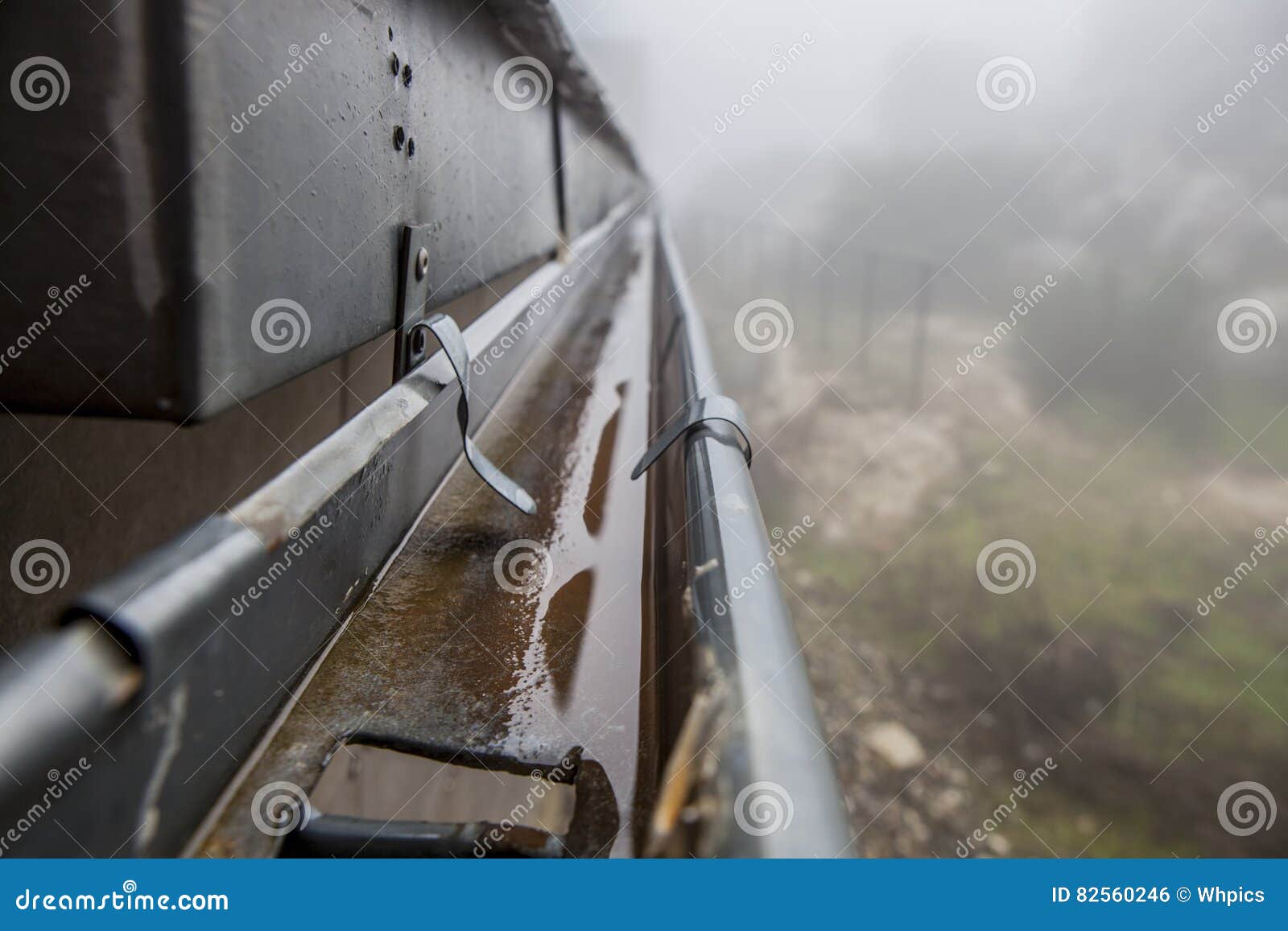 Gutter Drainage System on the Roof with Dripping Fog Stock Photo ...