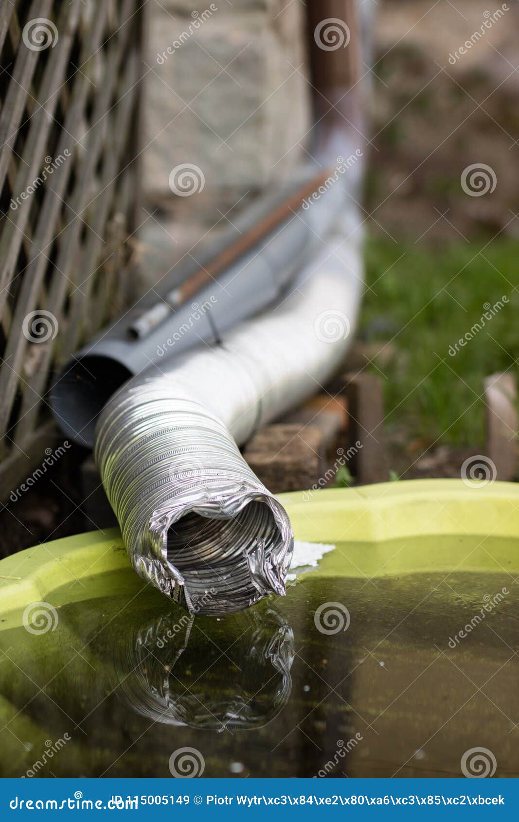 A Gutter Mounted on the Wall of the Building. Gutter Spout in Si Stock ...