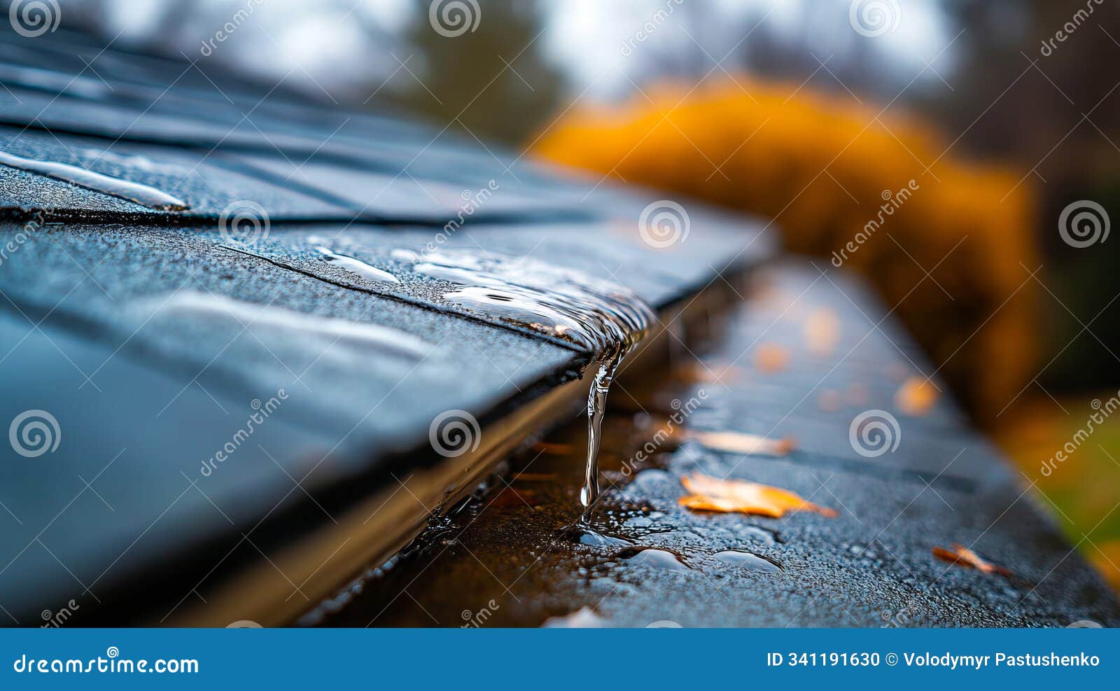 A Gutter with Water Coming Out of it on a Roof Stock Photo - Image of ...
