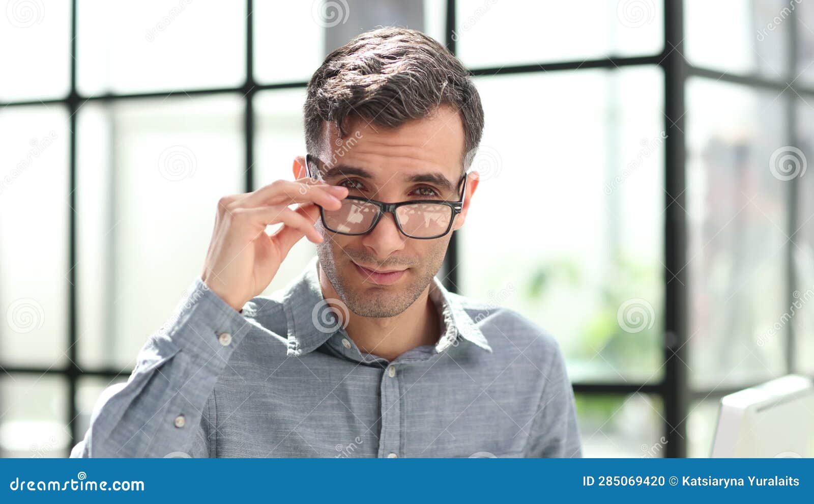 It Guy Adjusting Glasses in a Modern New Office Stock Footage - Video ...