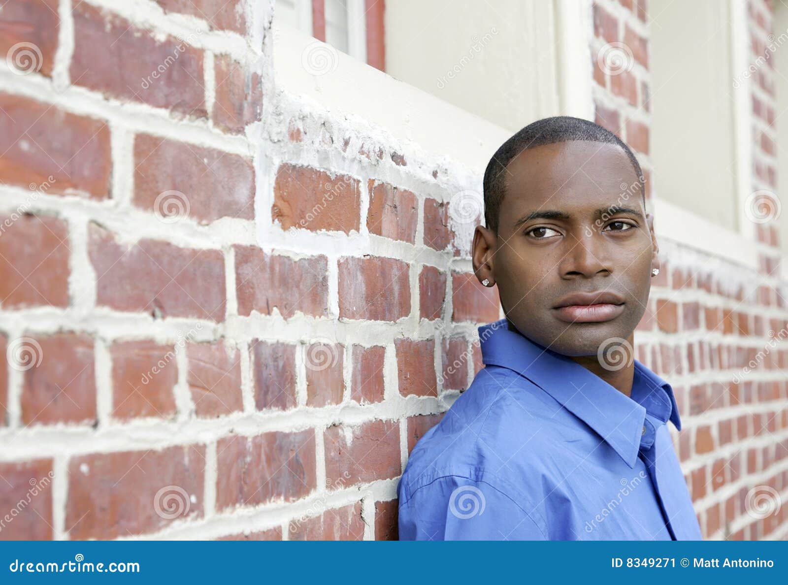 Guy against brick wall stock image. Image of relax, color - 8349271