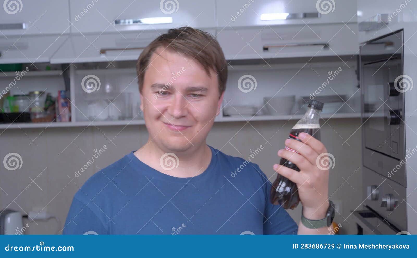 Guy Anticipates Drink Bottle of Soda, Turning Around, Scared, Drop ...