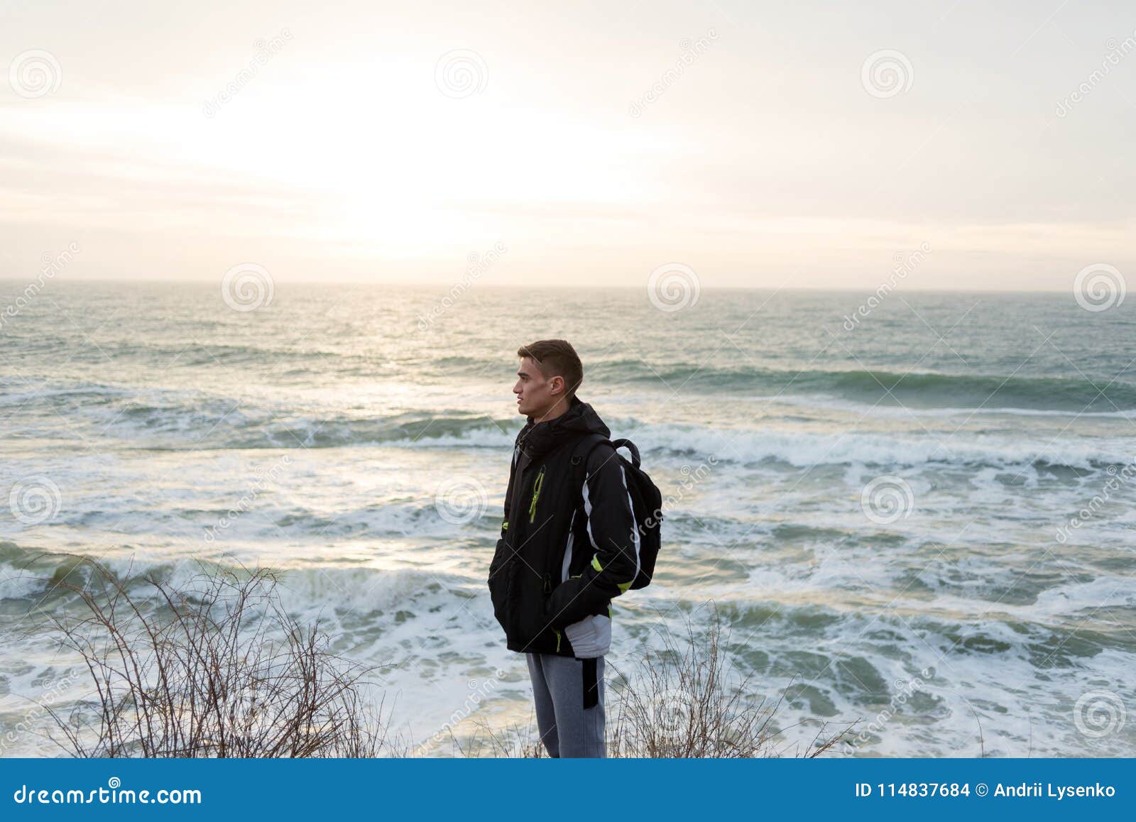 Guy on the Background of the Sea Looking into the Distance Stock Photo ...