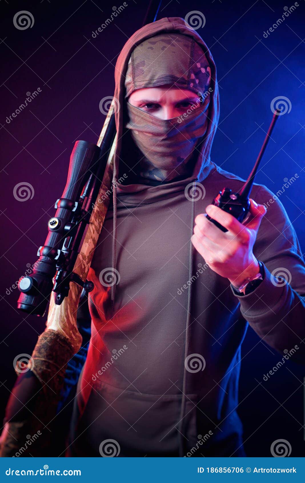 A Guy in a Balaclava with a Sniper Rifle in the Neon Light Stock Photo ...
