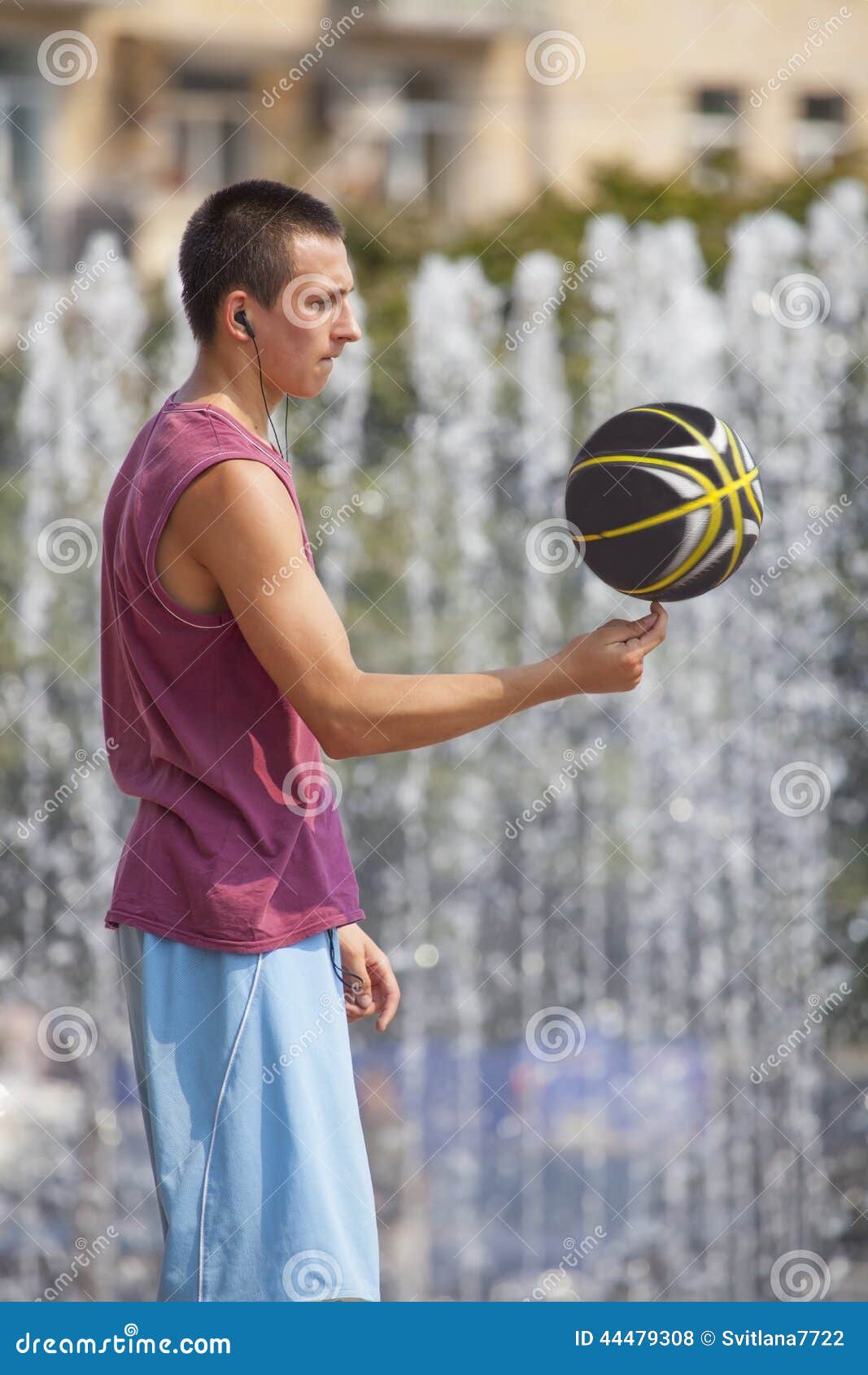 Guy with the Ball on the Index Finger. Stock Photo - Image of city ...