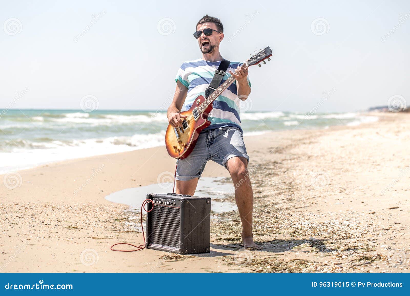 The Guy on the Beach with Musical Instruments Stock Image - Image of ...