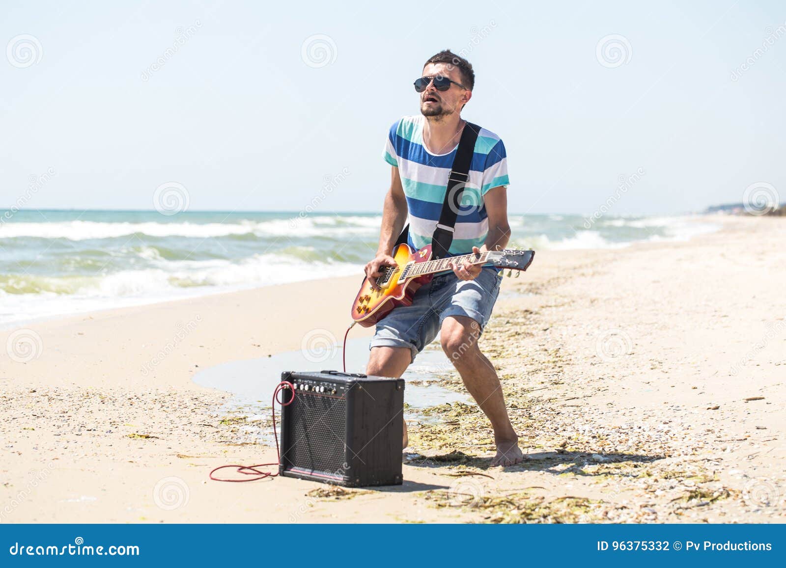 The Guy on the Beach with Musical Instruments Stock Photo - Image of ...