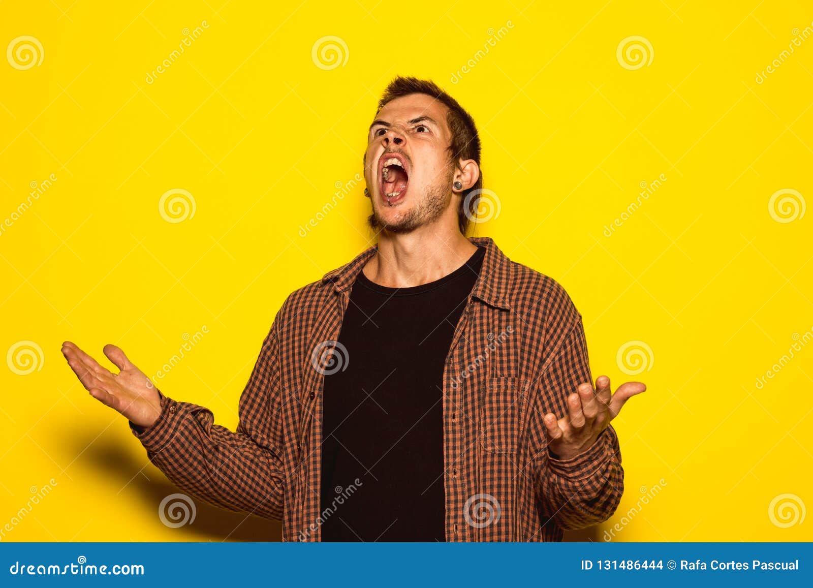 Guy with a Beard Doing a Funny and Crazy Expression Stock Photo - Image ...
